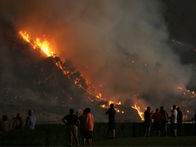 Holy Fire: More than 20,000 evacuated as fast-moving wildfire races ...